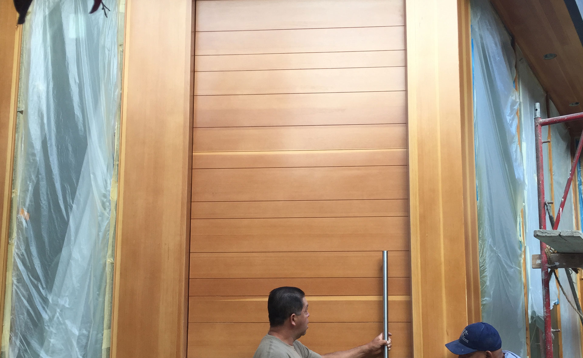 Sophisticated Entry Using a Large, Pivoting Front Door - Krueger Architects