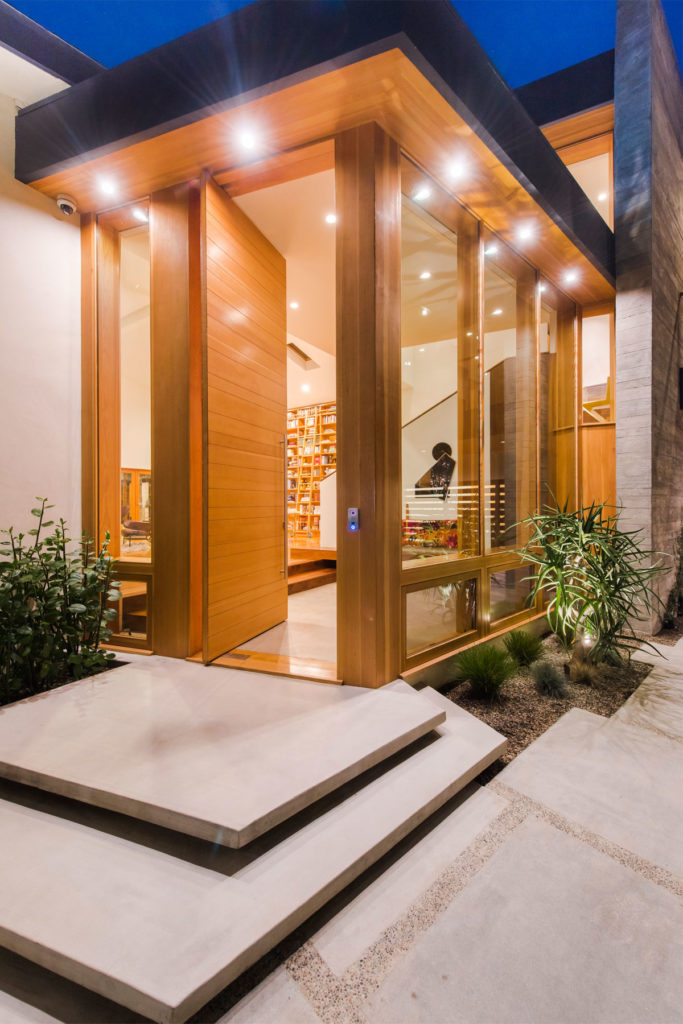 Sophisticated Entry Using a Large, Pivoting Front Door - Krueger Architects